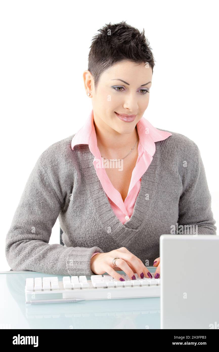 Happy businesswoman using computer Stock Photo - Alamy