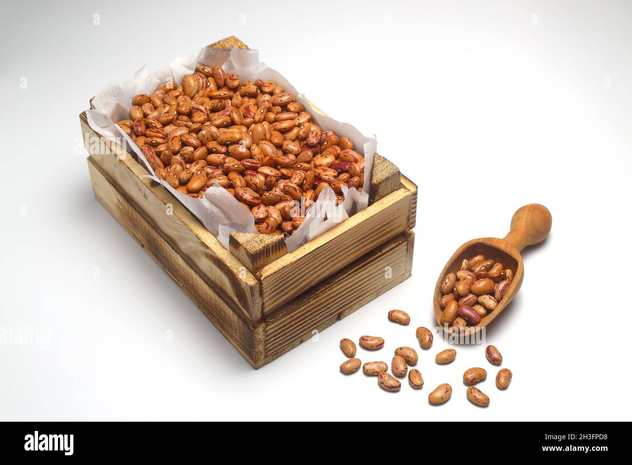 Kidney beans in a small wooden crate, isolated on white background ...