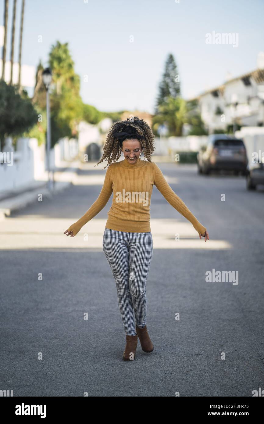 Vertical shot of a Spanish female posing near the building Stock Photo ...