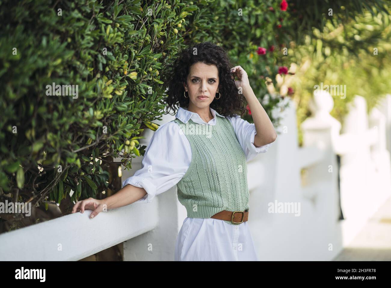 Spanish female posing in the street Stock Photo - Alamy