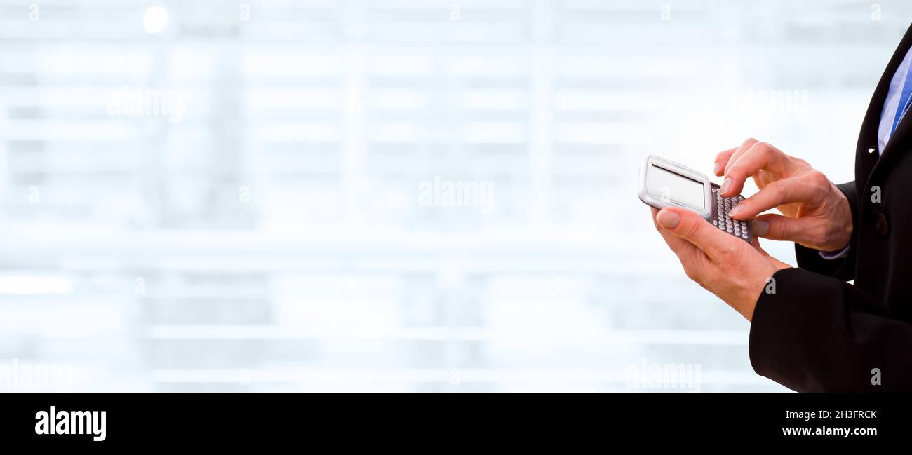 Hands using cellphone Stock Photo - Alamy