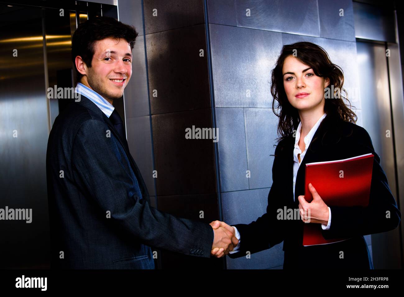 Business handshake at office Stock Photo - Alamy