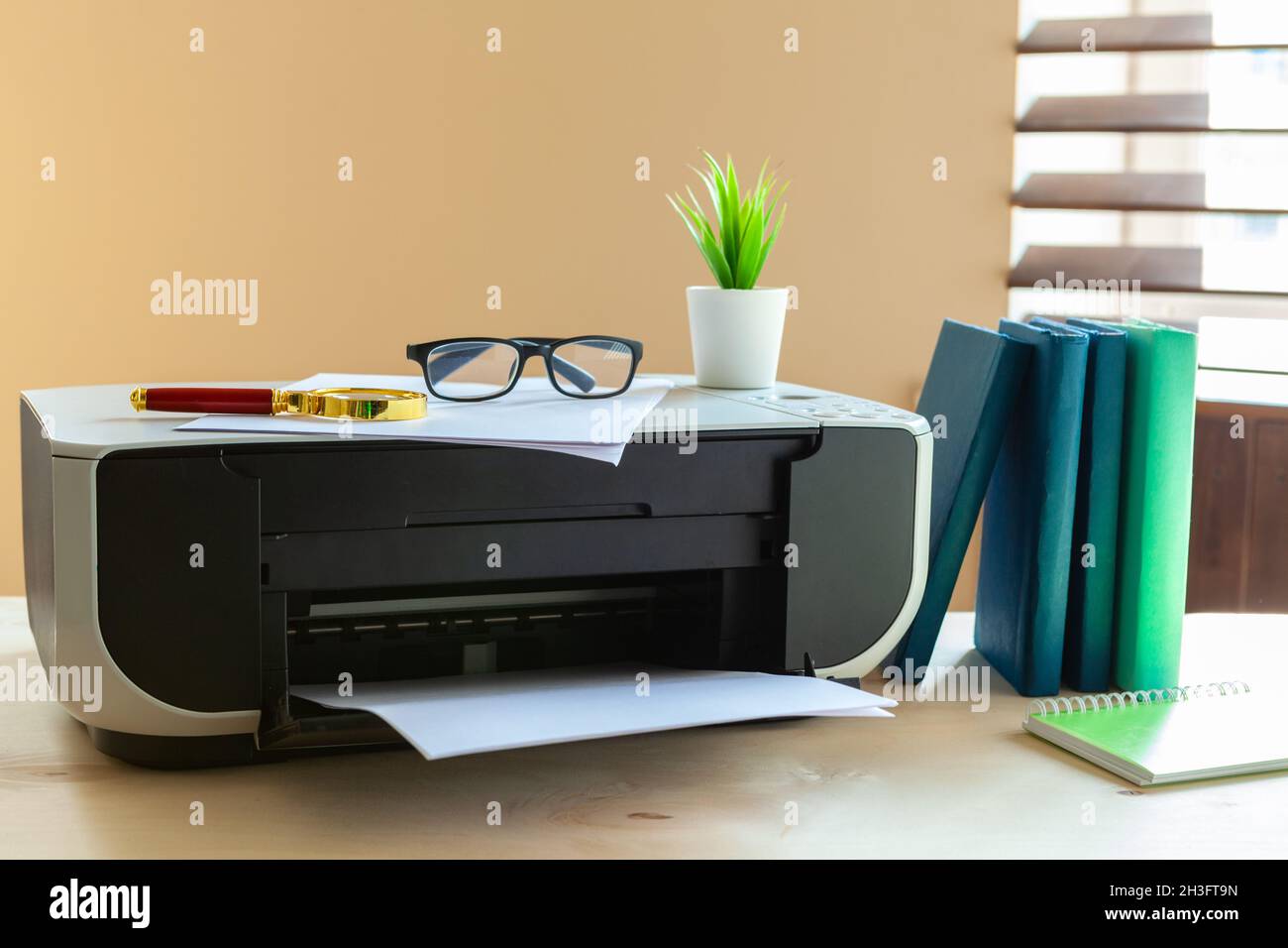 Close up of an office table with printer on it Stock Photo - Alamy