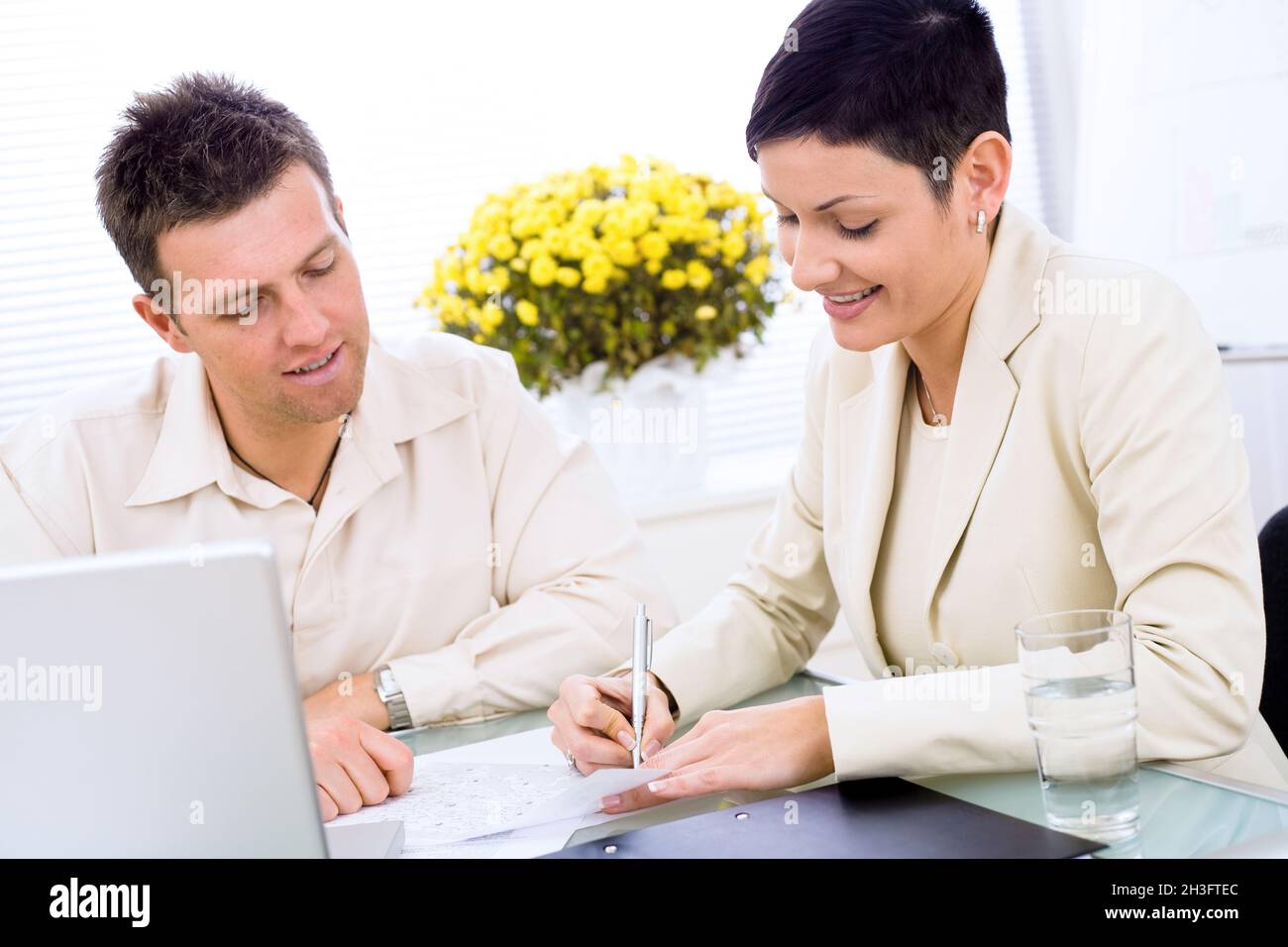 Business couple working Stock Photo - Alamy