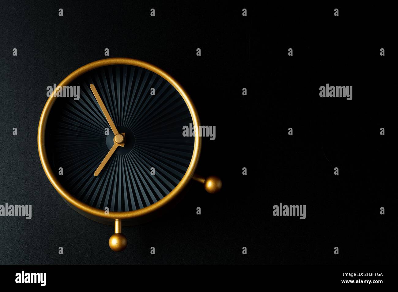 Alarm clock close up on black background Stock Photo - Alamy