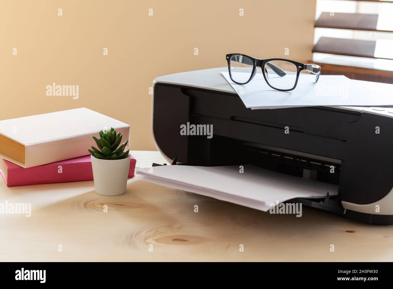 Close up of an office table with printer on it Stock Photo - Alamy