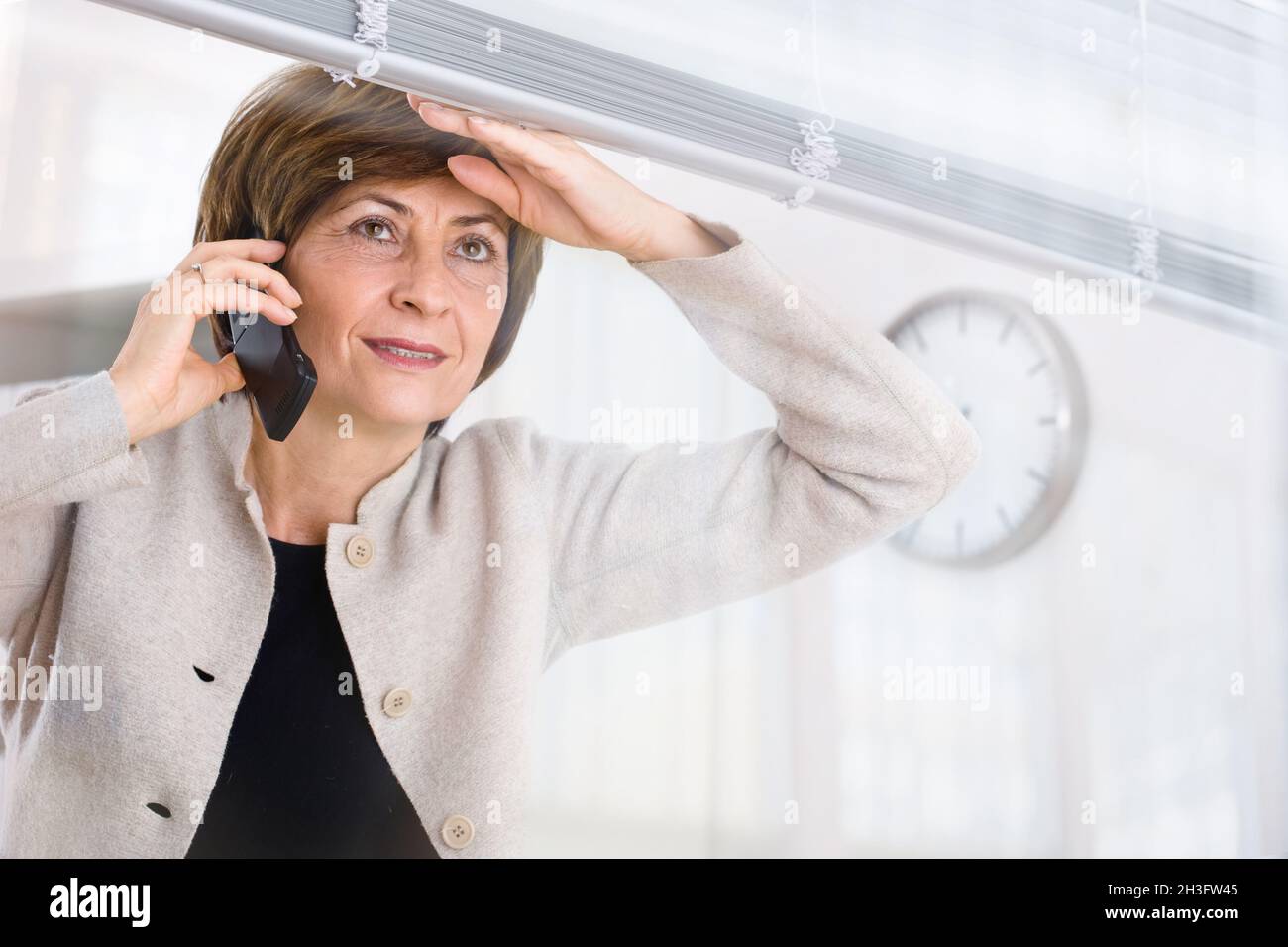 Senior looking at clock hi-res stock photography and images - Alamy