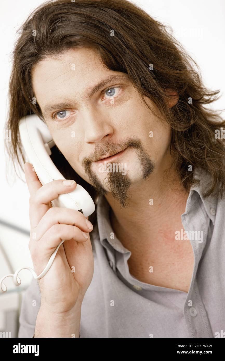Man talking on phone Stock Photo - Alamy