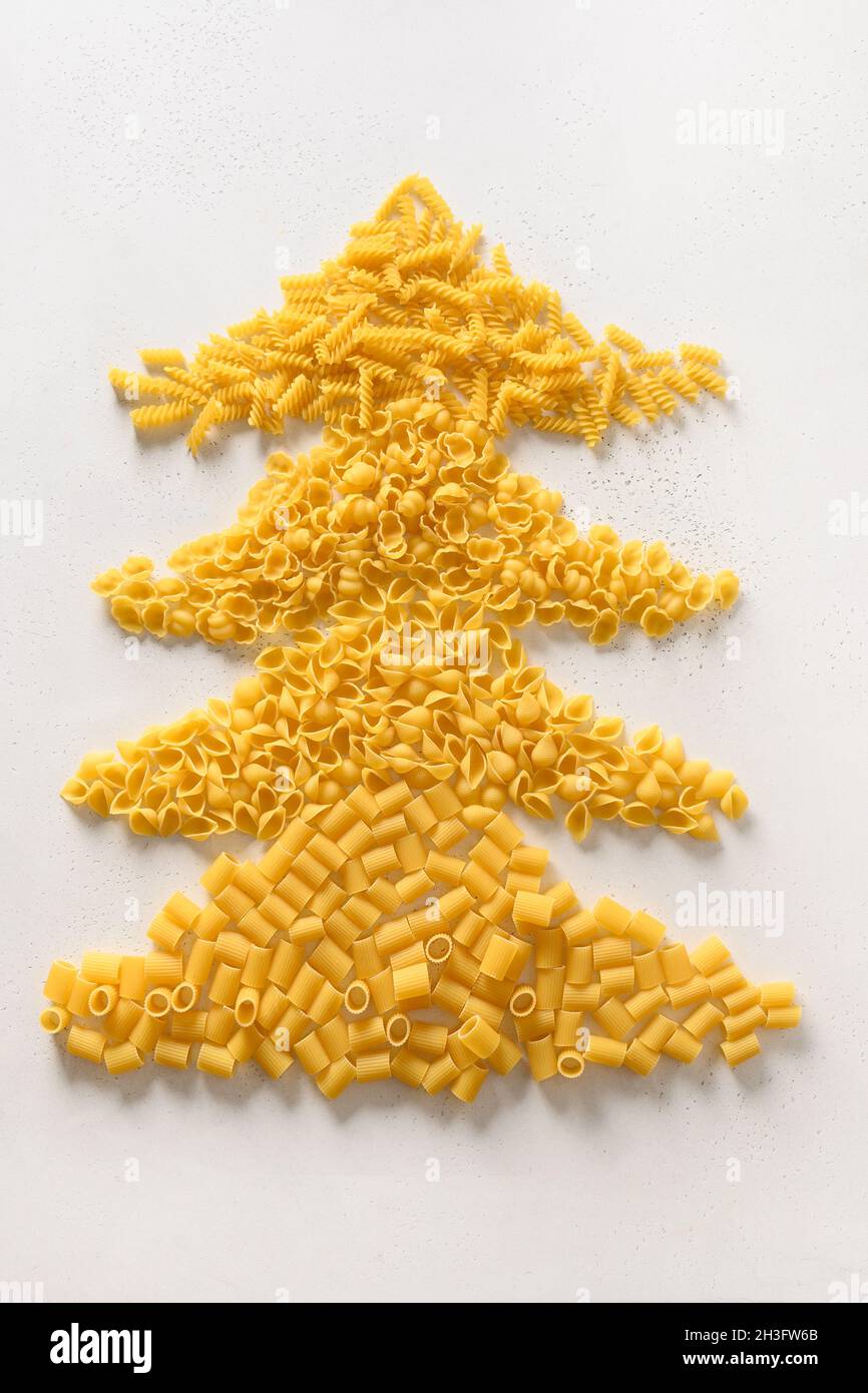 Alternative Christmas tree of dry Italian pasta on white background ...