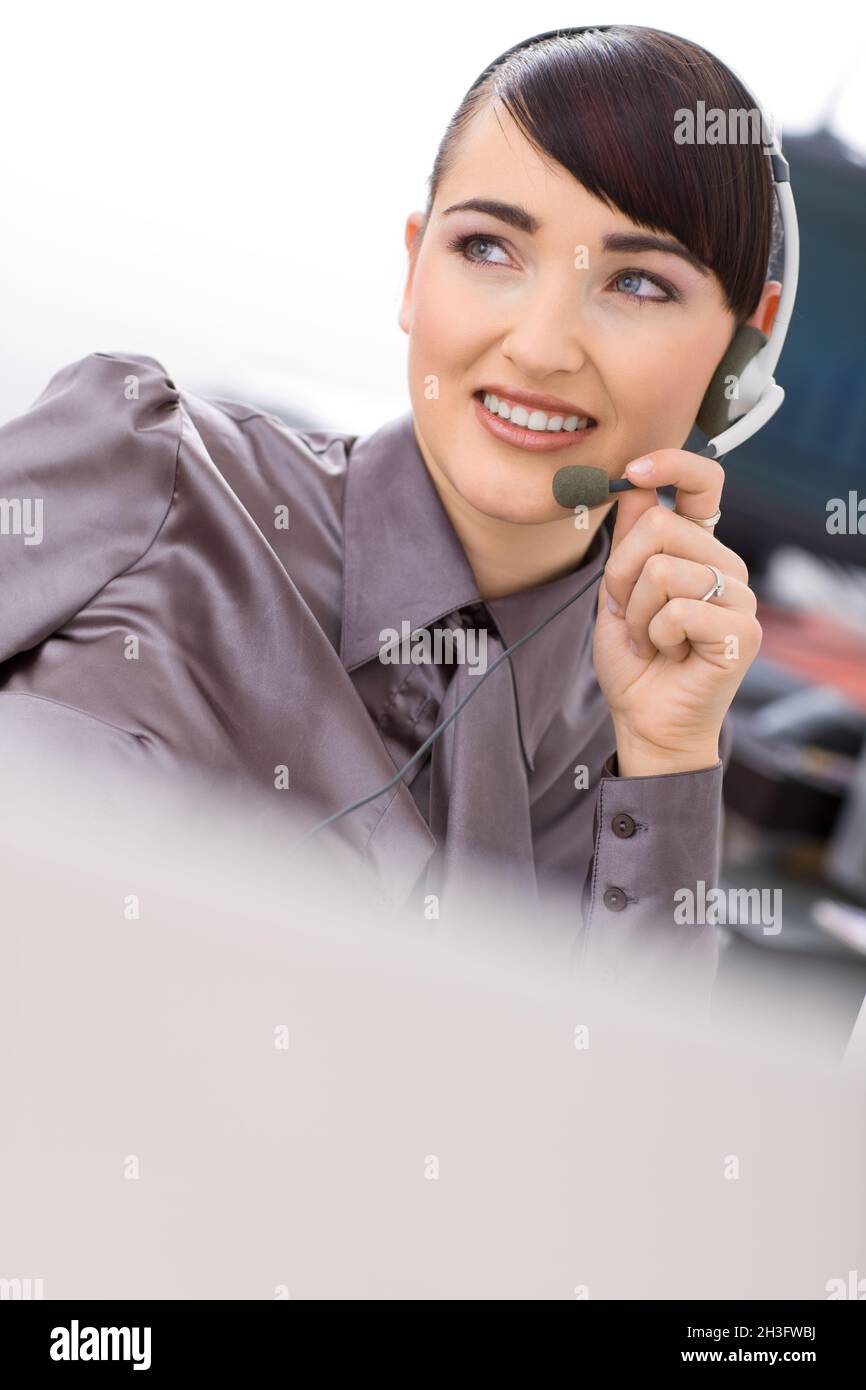 Operator talking on headset Stock Photo - Alamy