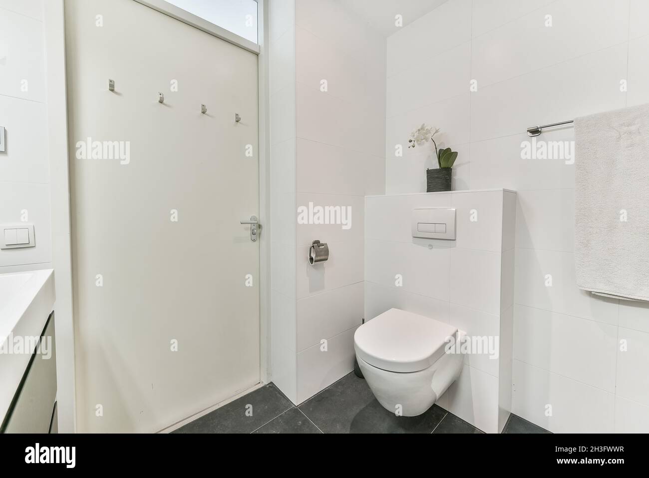 Interior of small clean restroom in miniature style Stock Photo - Alamy