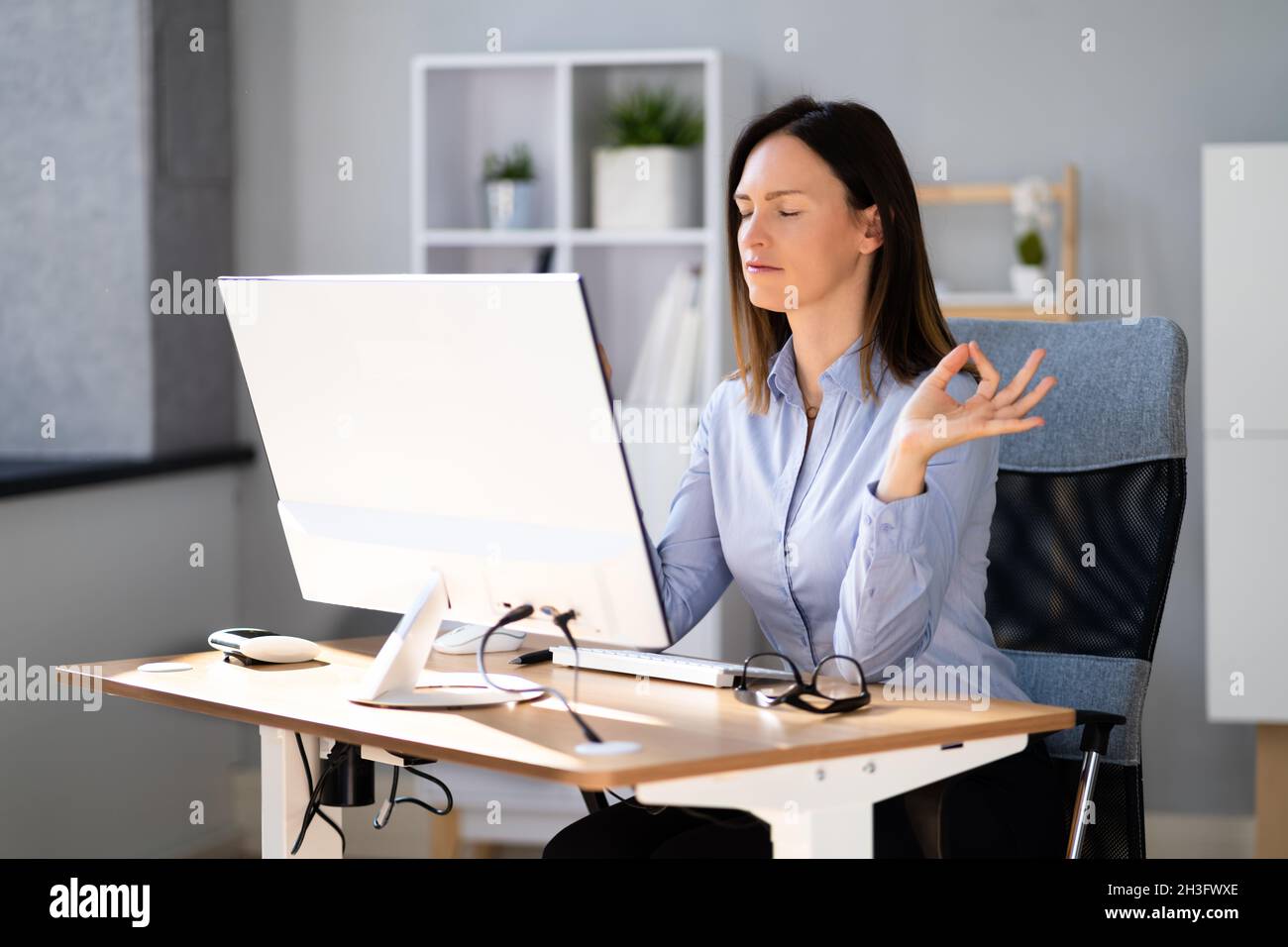 Healthy Yoga Meditation Exercise In Office Chair At Workplace Stock ...