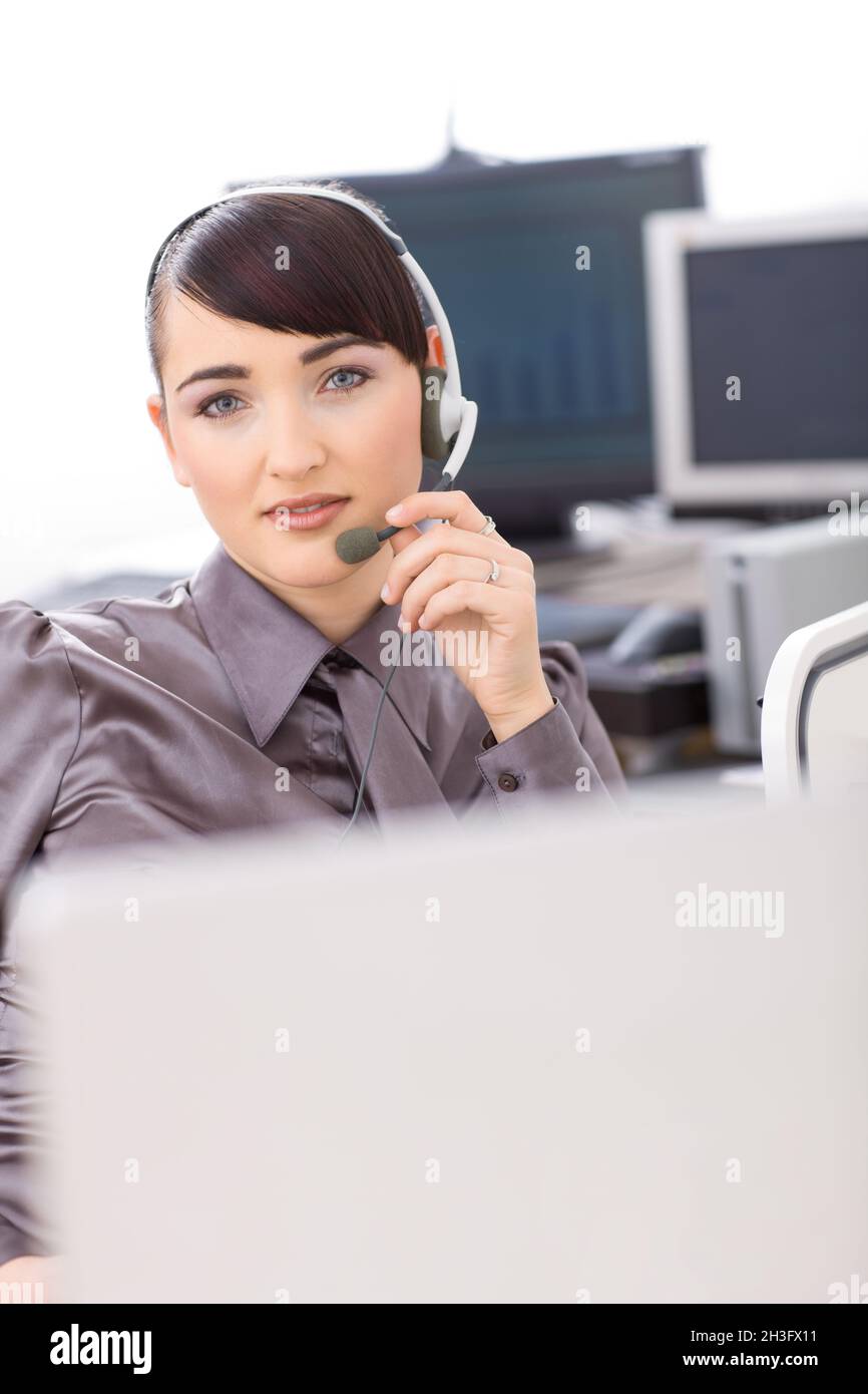 Operator talking on headset Stock Photo - Alamy
