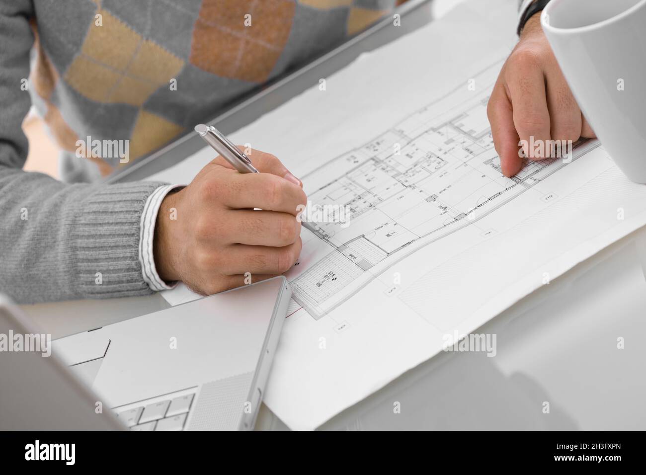 Hands drawing blueprint Stock Photo - Alamy