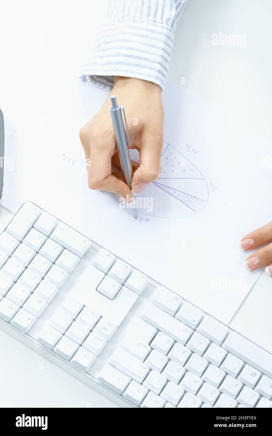 Female hand drawing chart Stock Photo - Alamy