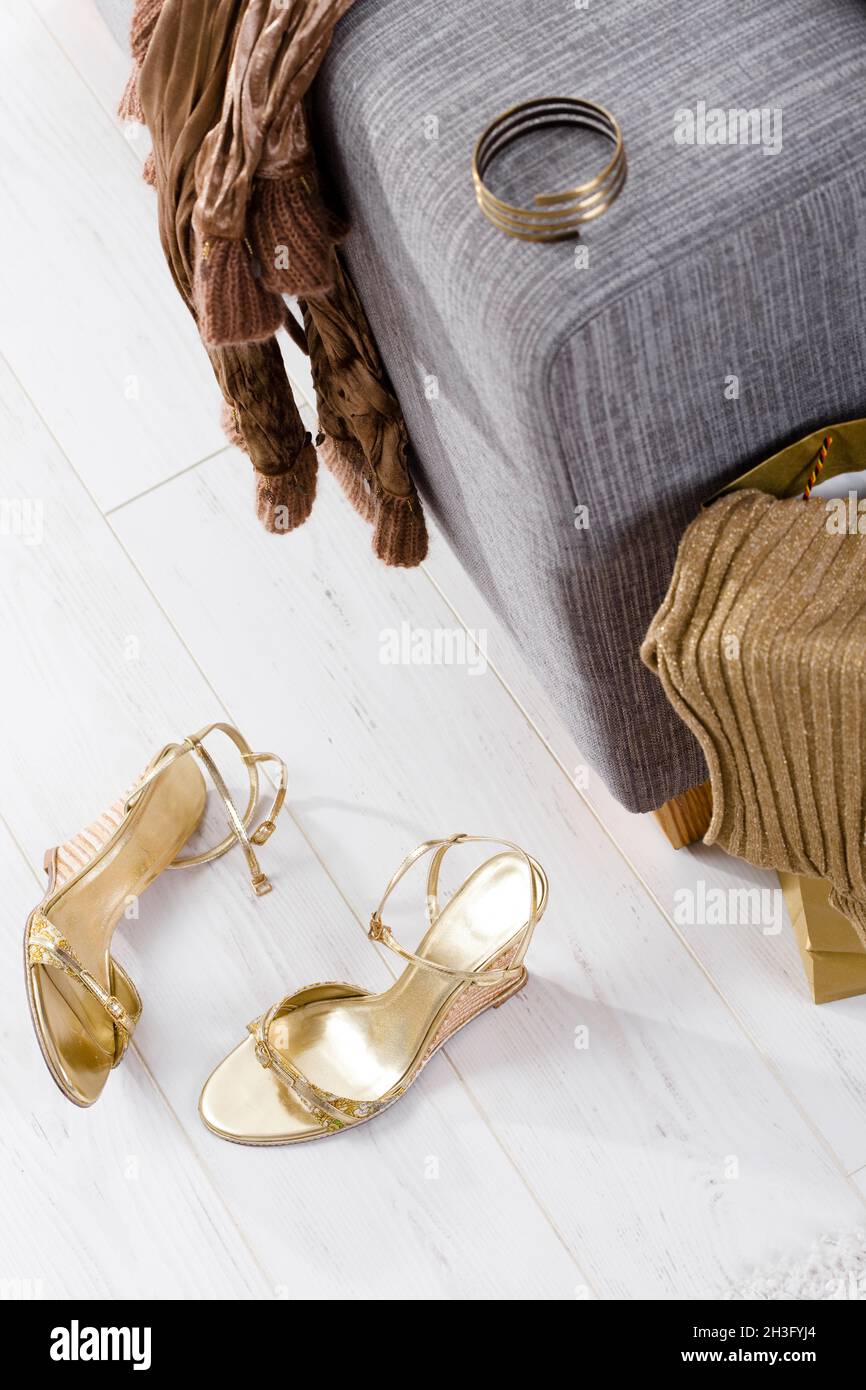Clothes on couch Stock Photo - Alamy