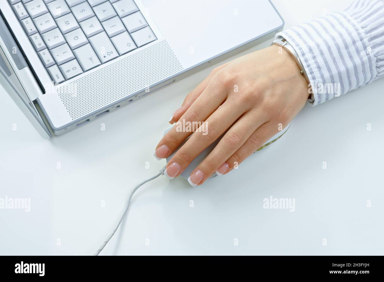 Female hand using computer mouse Stock Photo - Alamy