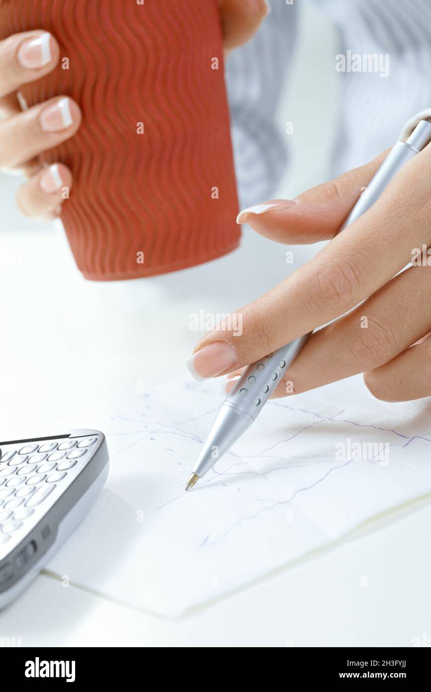 Female hand drawing graph Stock Photo - Alamy