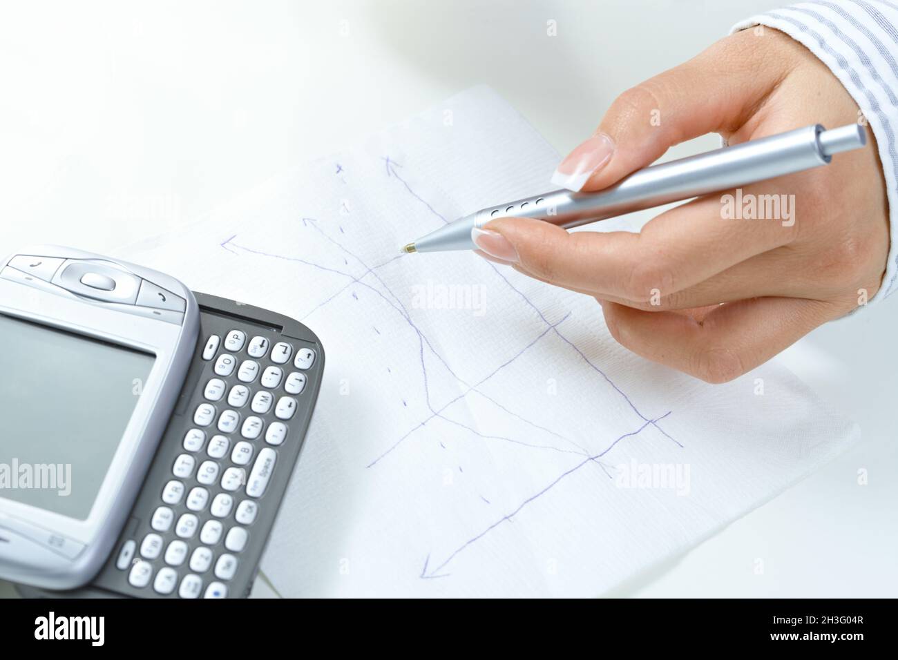 Female hand drawing graph Stock Photo - Alamy