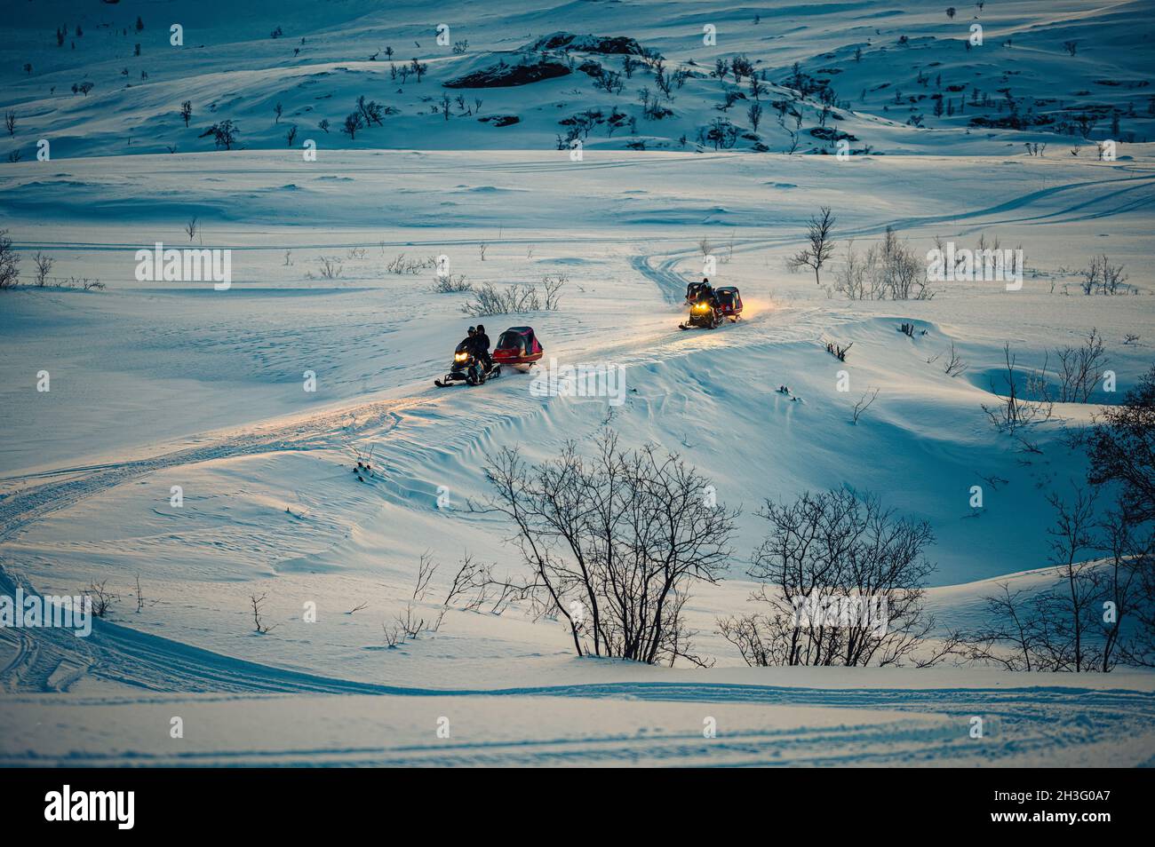 Beautiful view of people sliding in the snow Stock Photo - Alamy