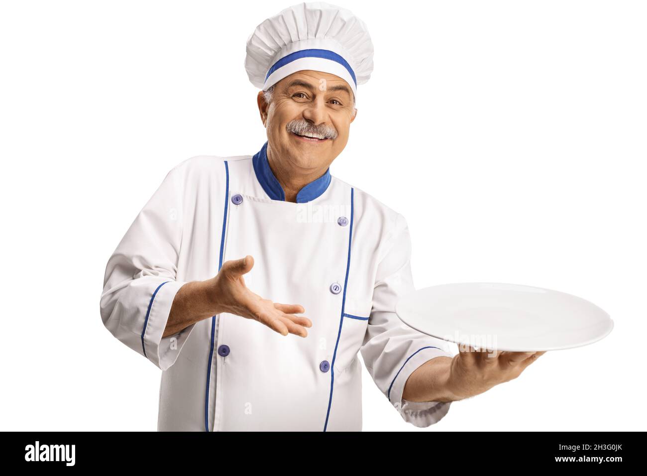 Cheerful male chef smiling and holding an empty plate isolated on white ...