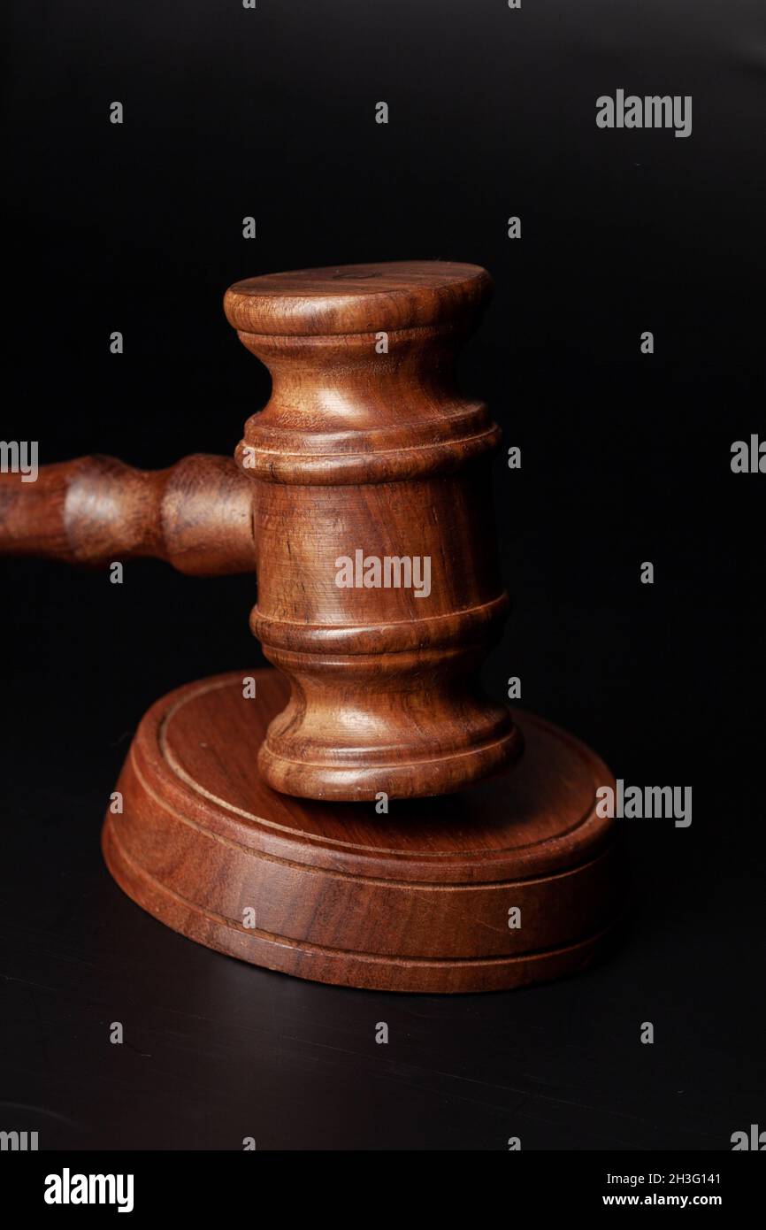 Wooden judges gavel on table close up Stock Photo - Alamy