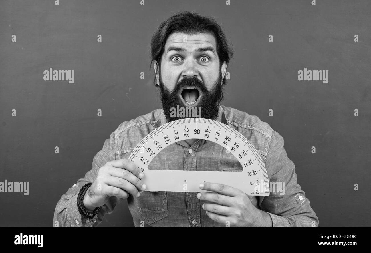 man surprised with size measured on protractor ruler math tool, school ...