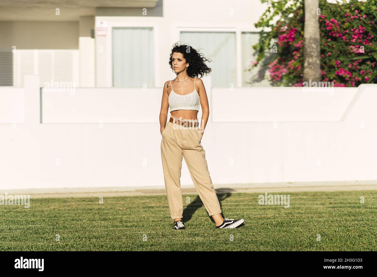 Spanish female posing in the street Stock Photo - Alamy