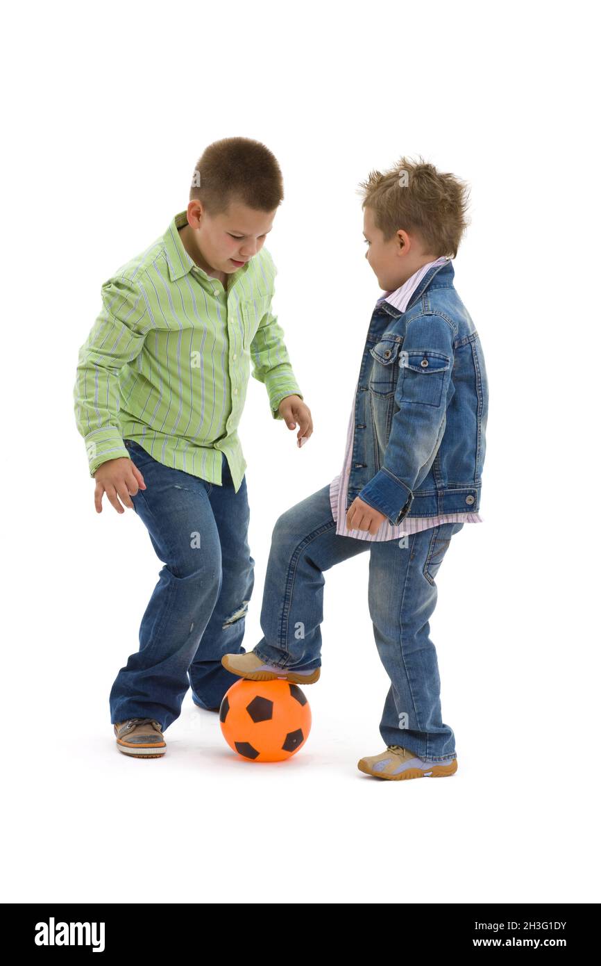 Boys playing football Stock Photo - Alamy