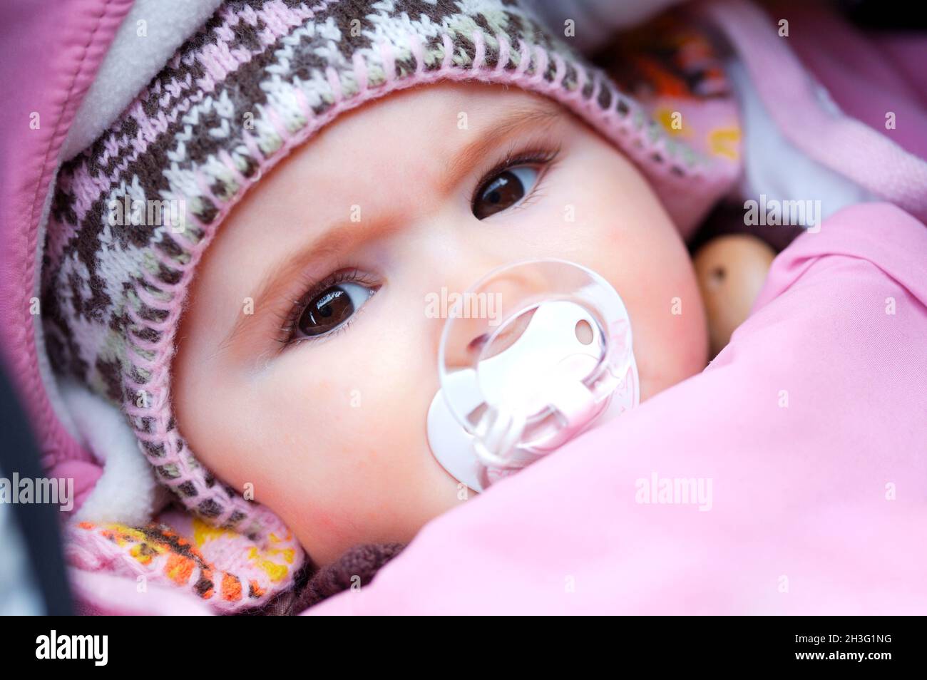 Baby in winter Stock Photo - Alamy