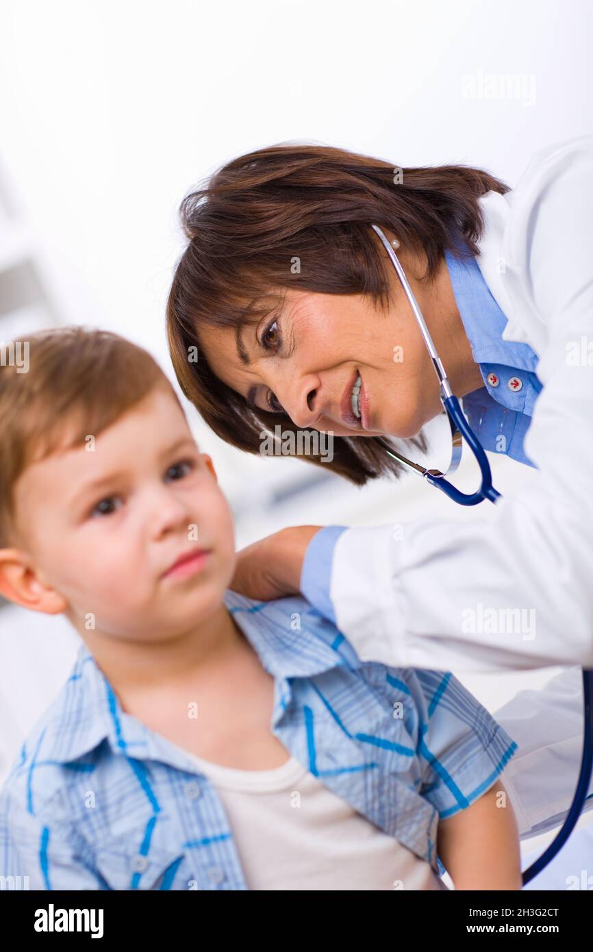 Doctor examining child Stock Photo - Alamy