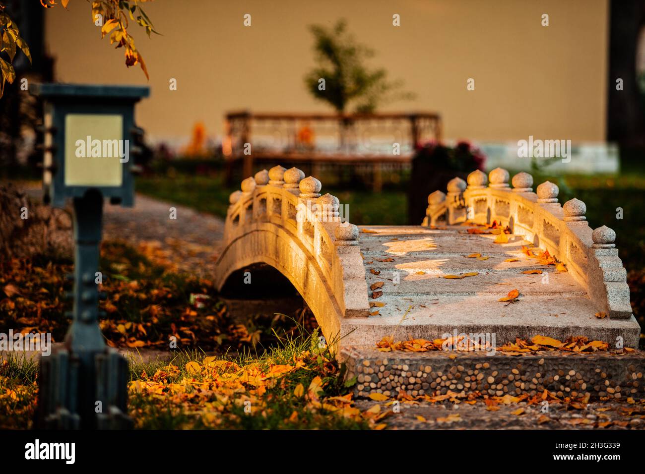 small chinese bridge over the river Stock Photo - Alamy