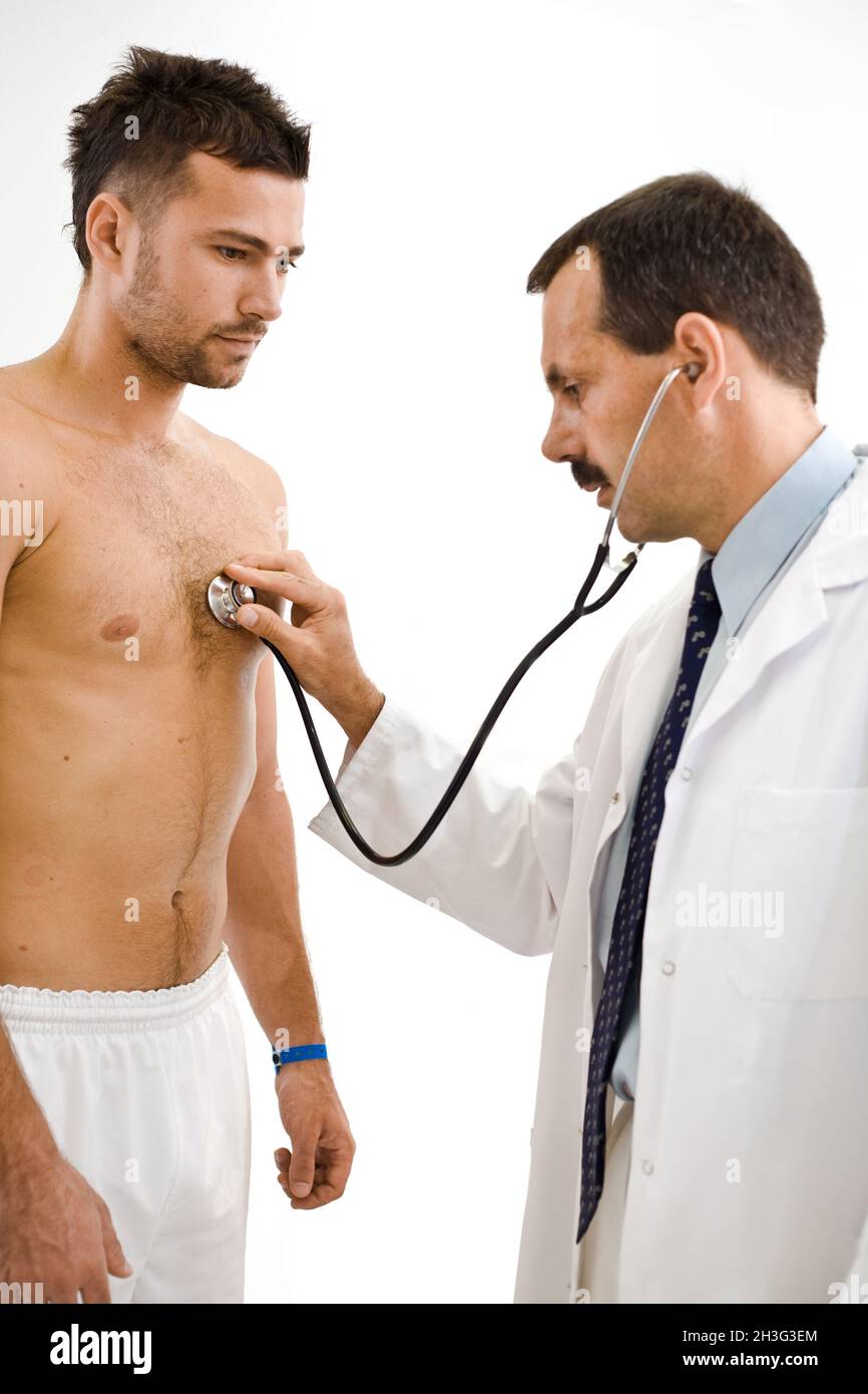 Doctor examining patient Stock Photo - Alamy