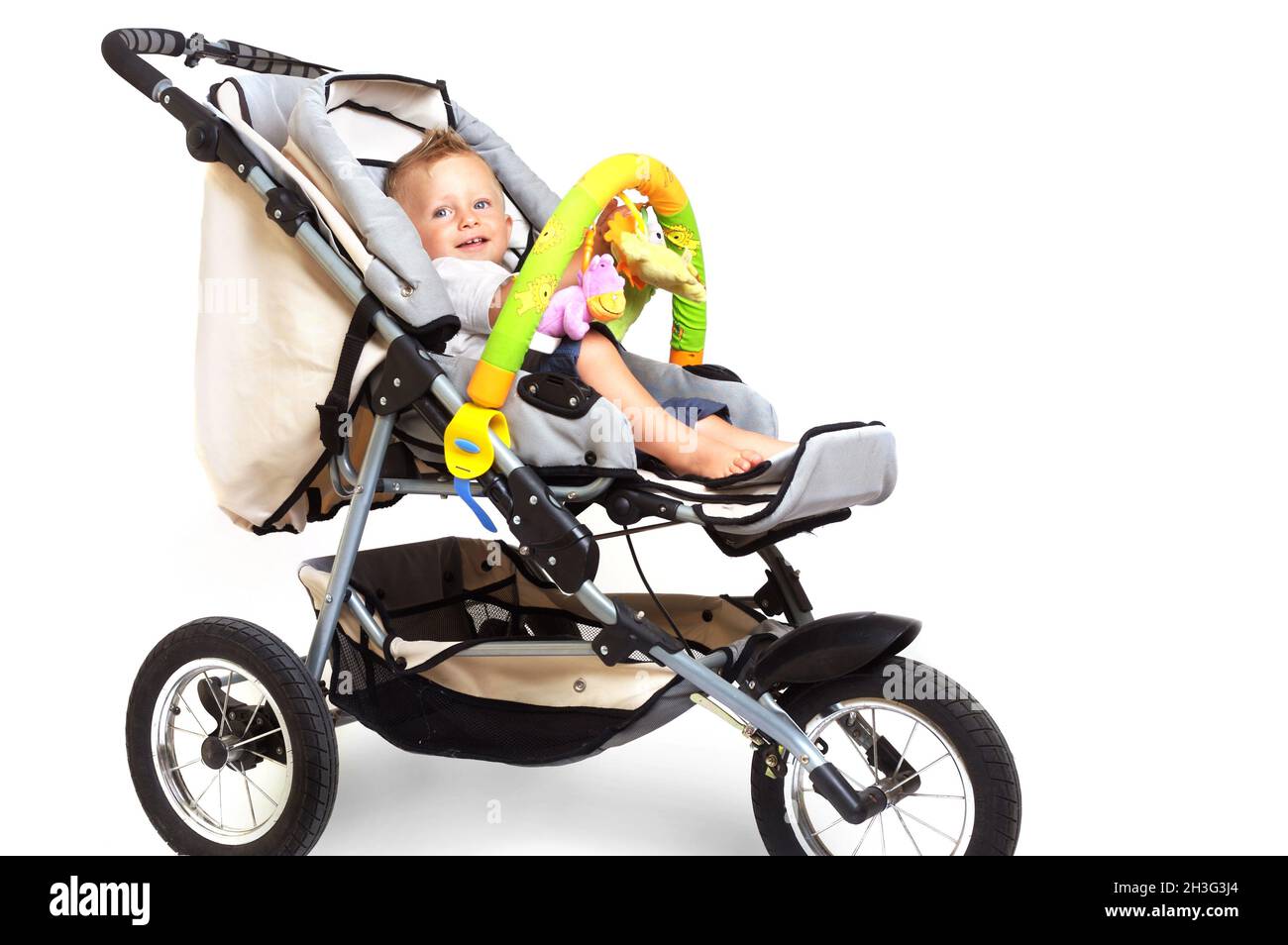 Happy baby in stroller Stock Photo - Alamy