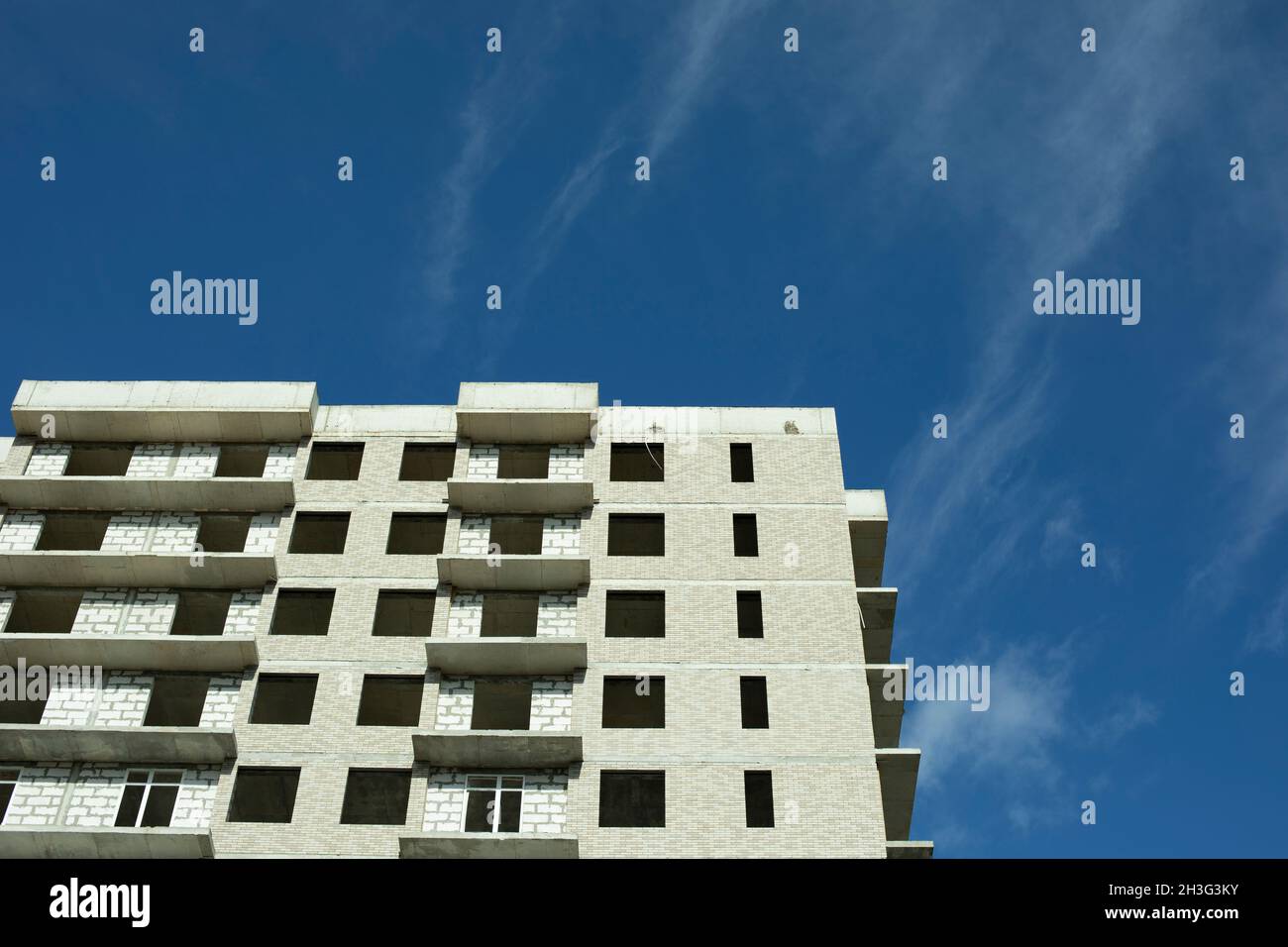 Unfinished building. House without cladding. Window openings without ...