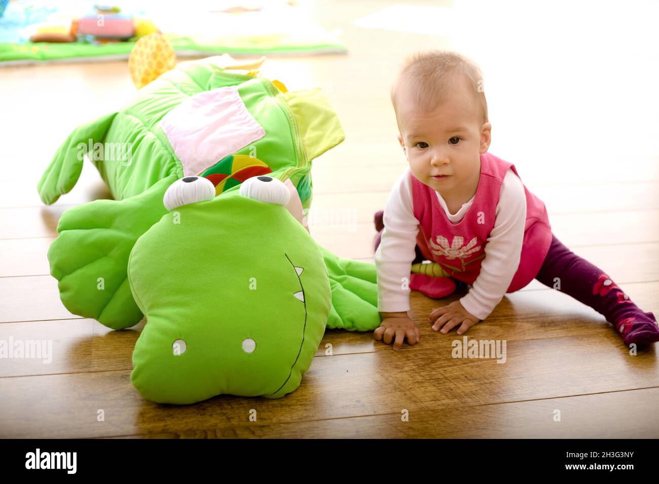 Baby playing at home Stock Photo - Alamy