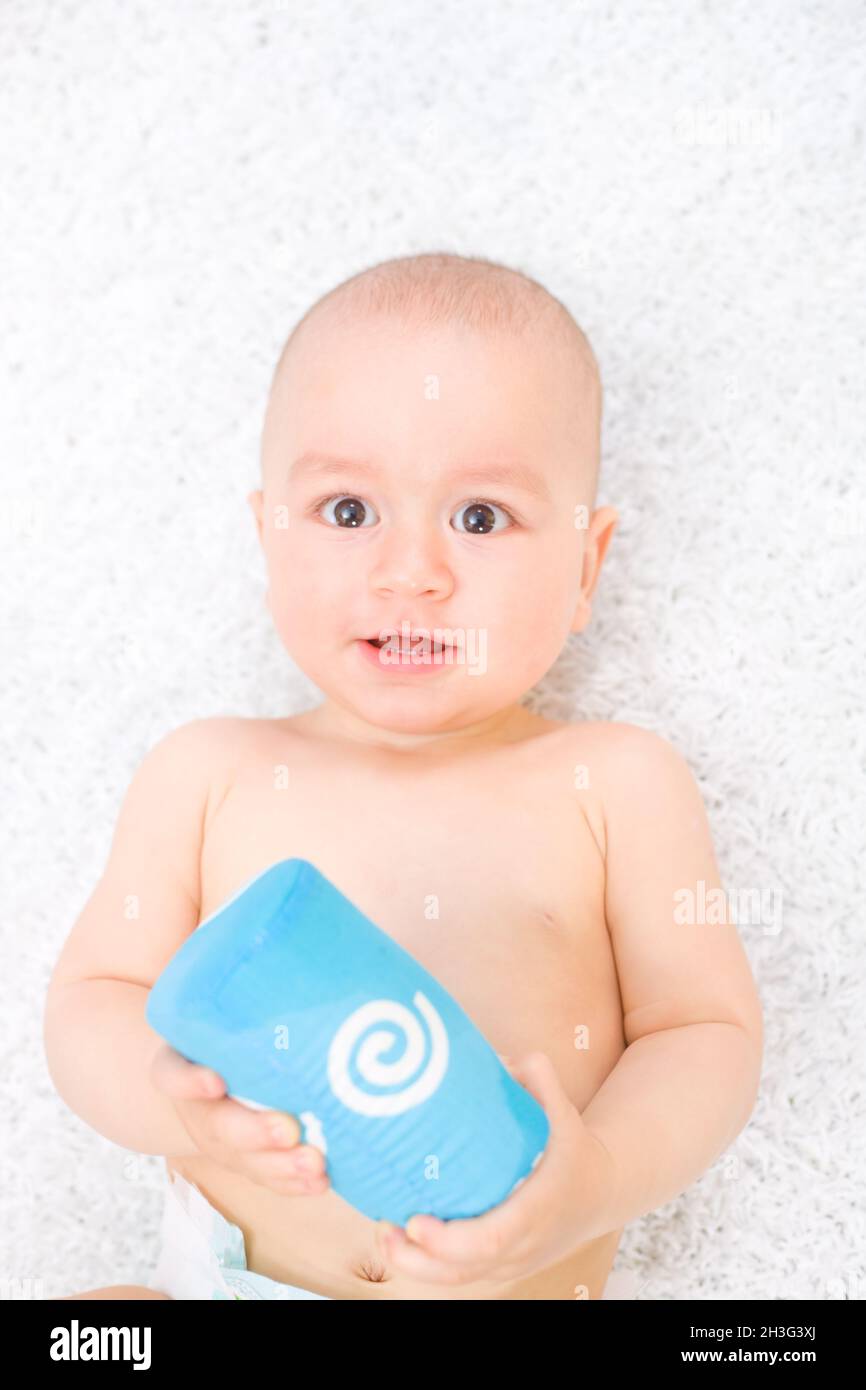 Happy baby playing Stock Photo - Alamy