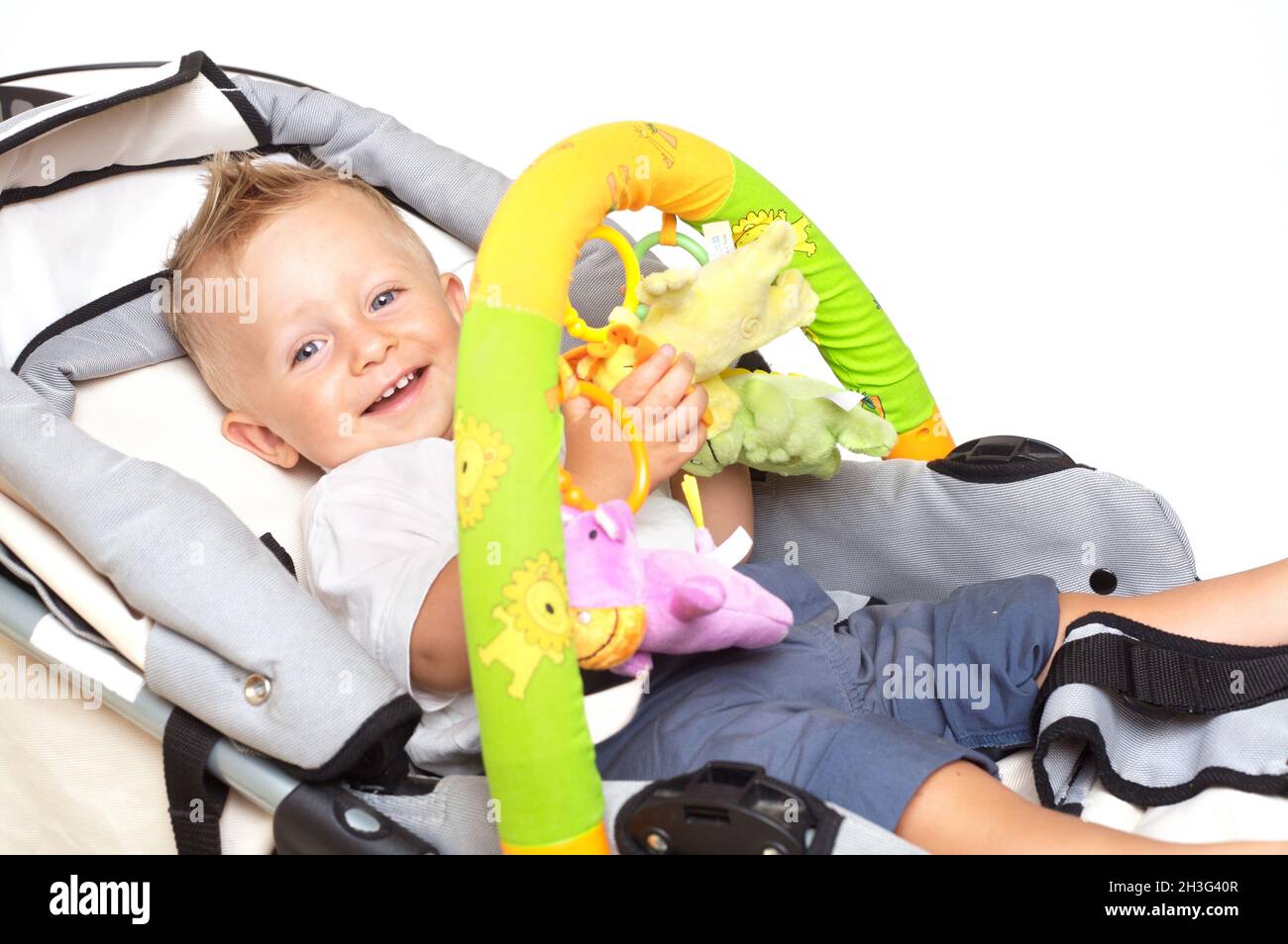 Happy baby in stroller Stock Photo - Alamy