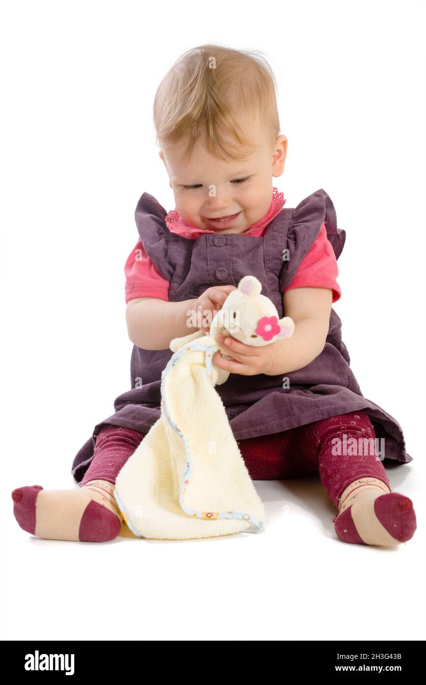 Baby girl playing Stock Photo - Alamy