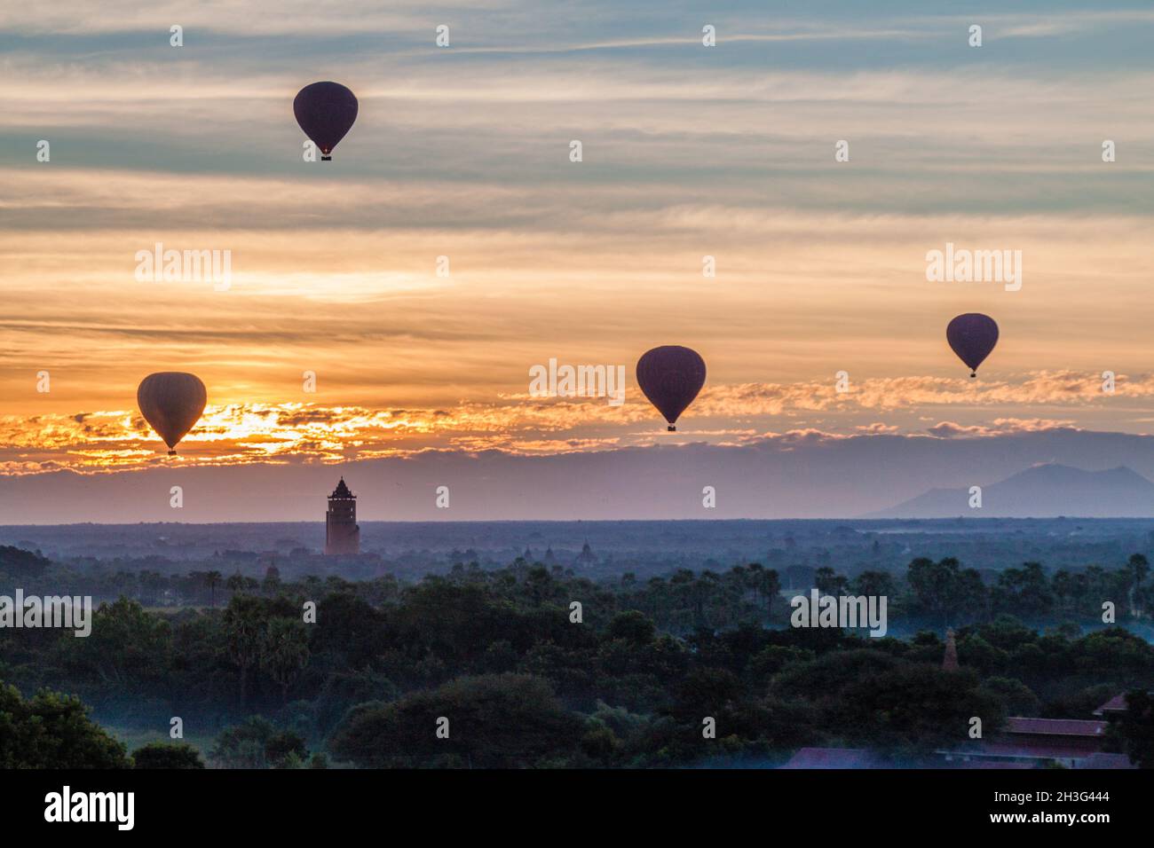 Balloons over Bagan with viewing tower, Myanmar Stock Photo - Alamy