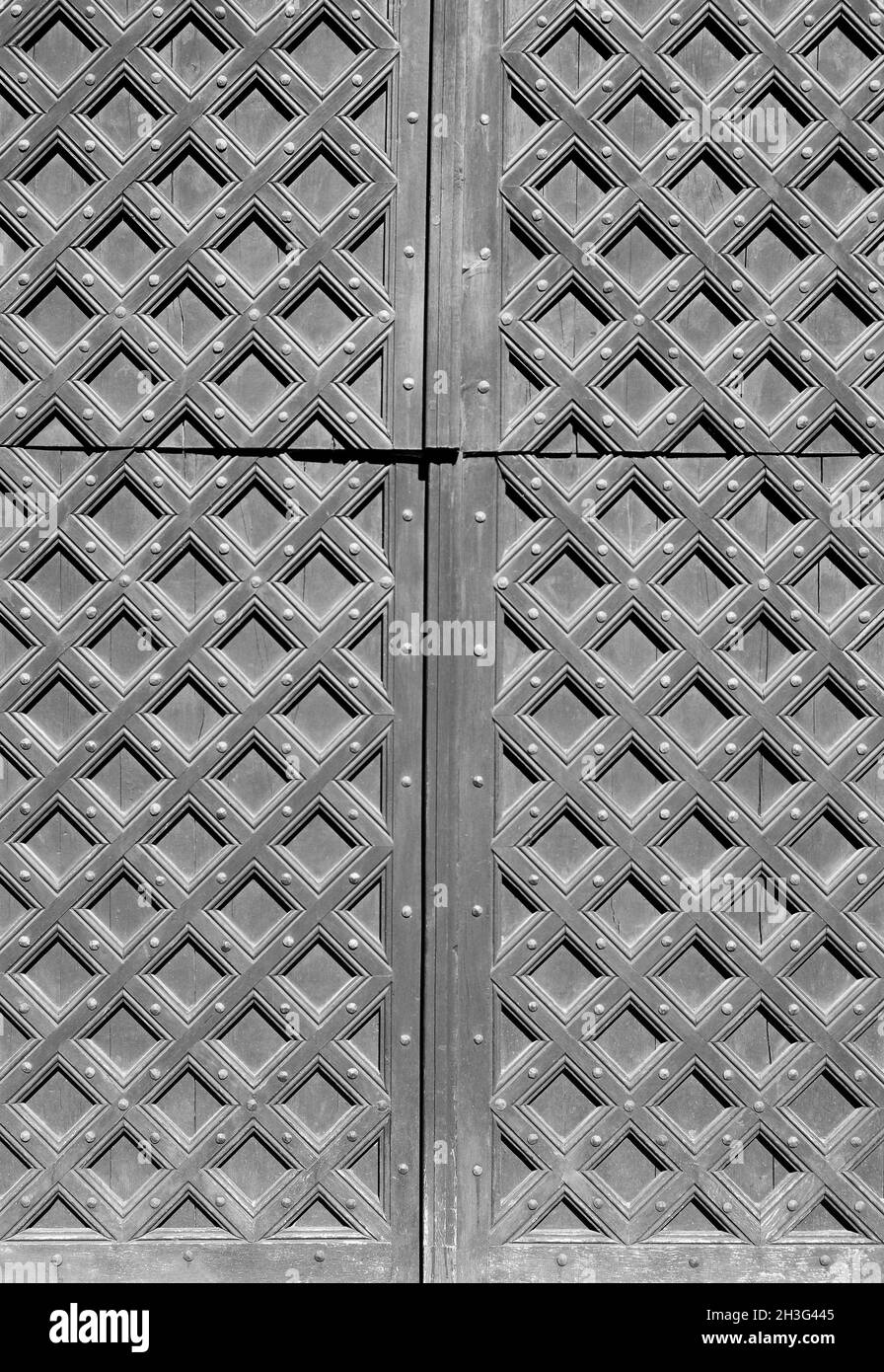 Wooden textured door. Grey front wall background Stock Photo - Alamy