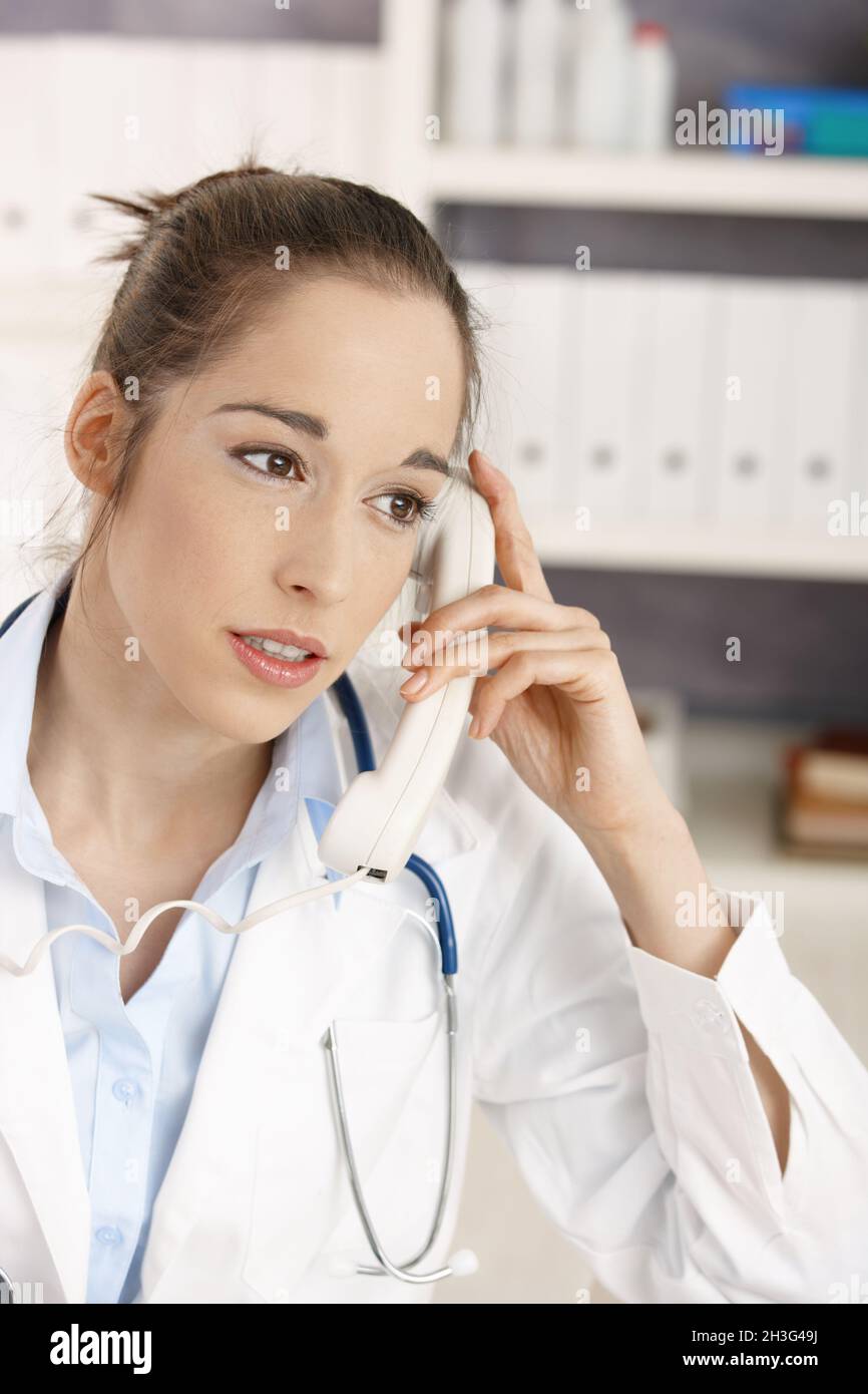 Female doctor on the phone Stock Photo - Alamy