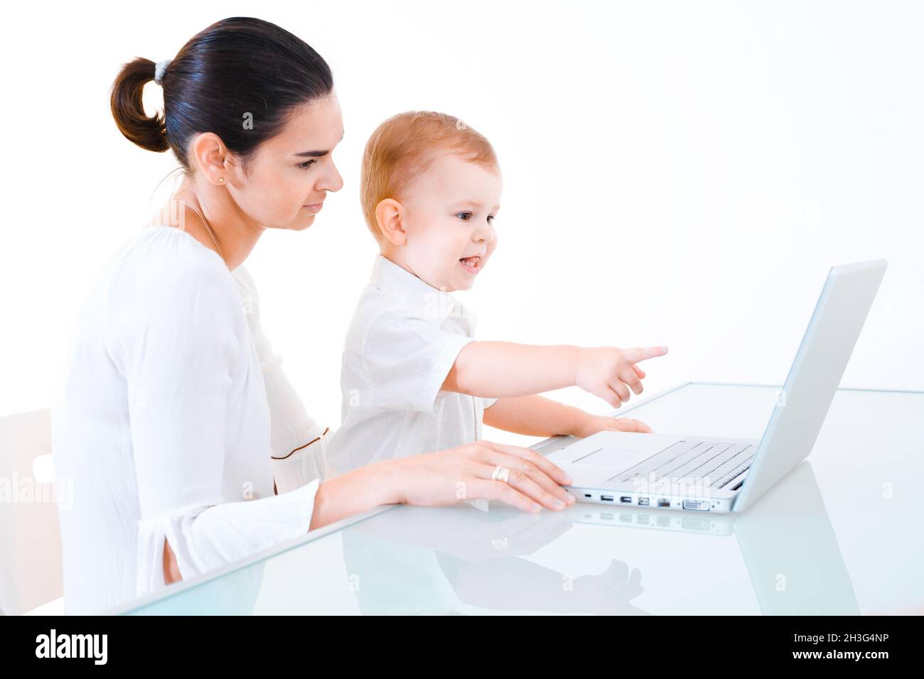 Mother and baby using laptop Stock Photo - Alamy