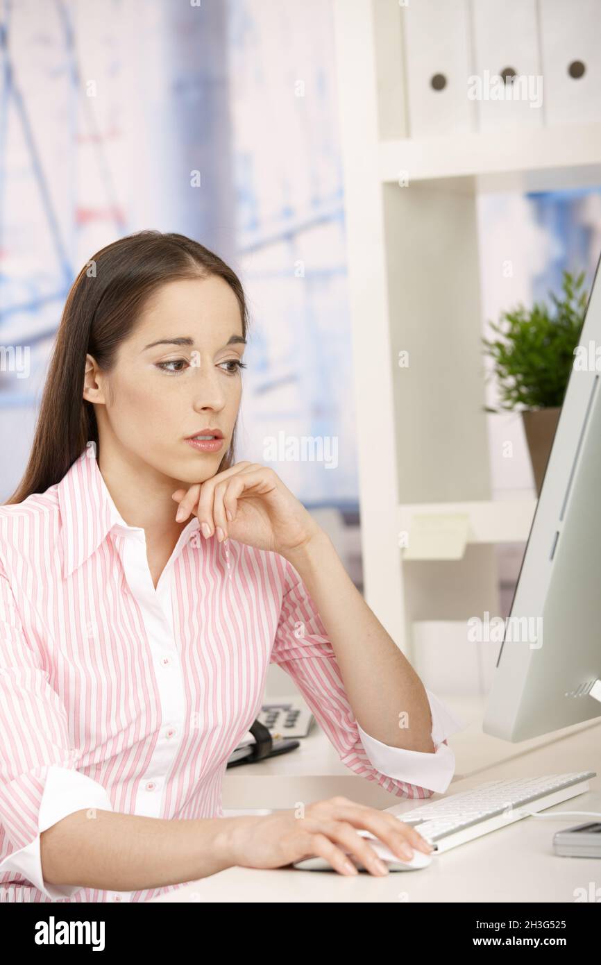 Assistant girl at computer Stock Photo - Alamy