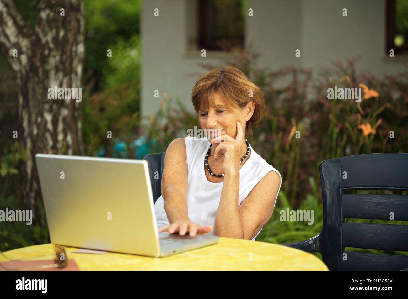 Senior women with laptop Stock Photo - Alamy