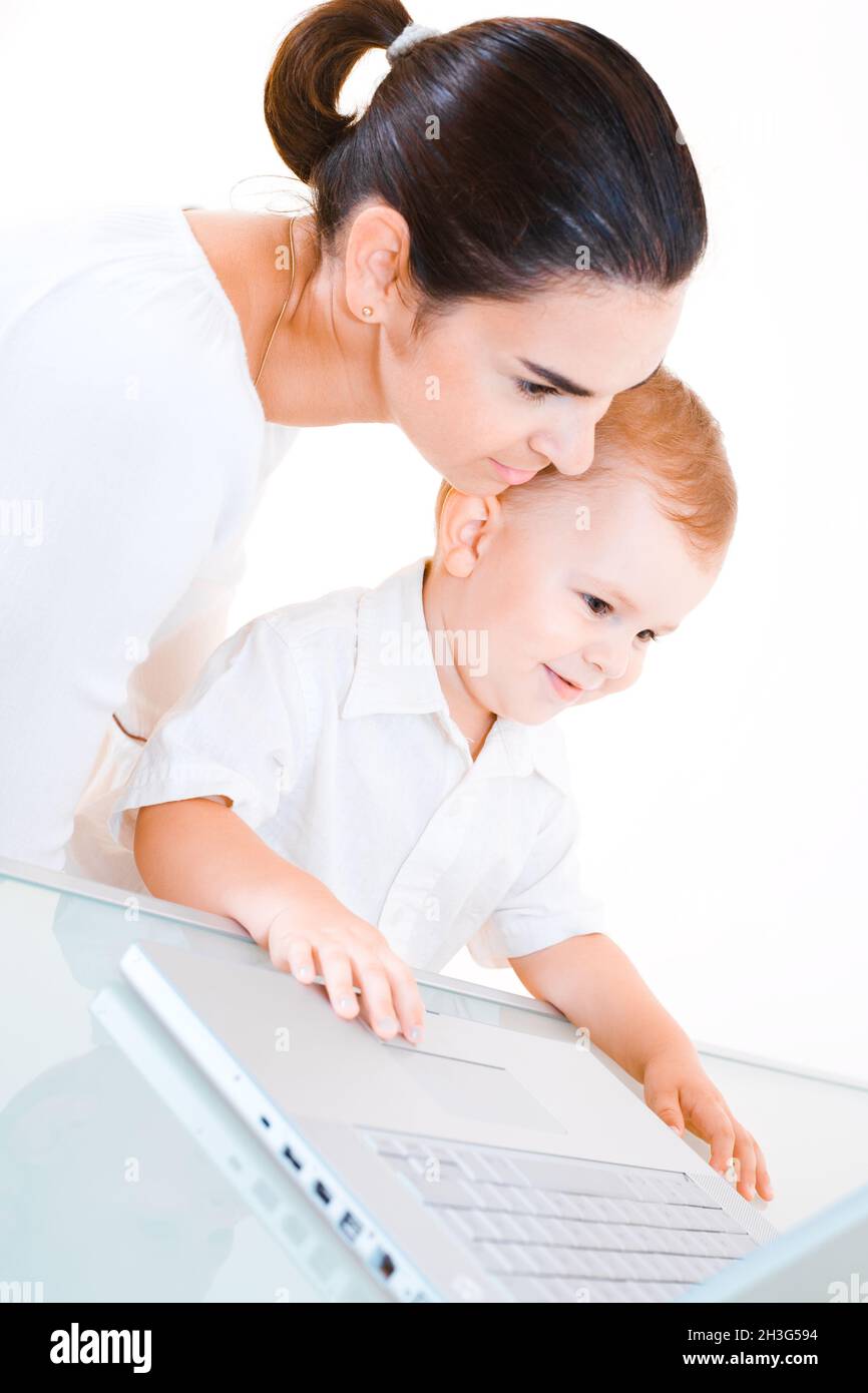 Mother and baby using laptop Stock Photo - Alamy