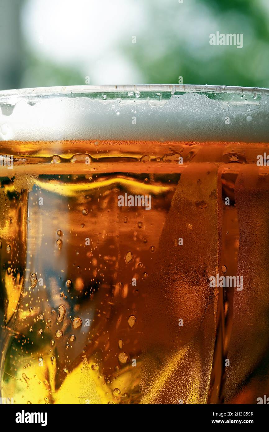 Mug of beer with foam closeup as background Stock Photo - Alamy
