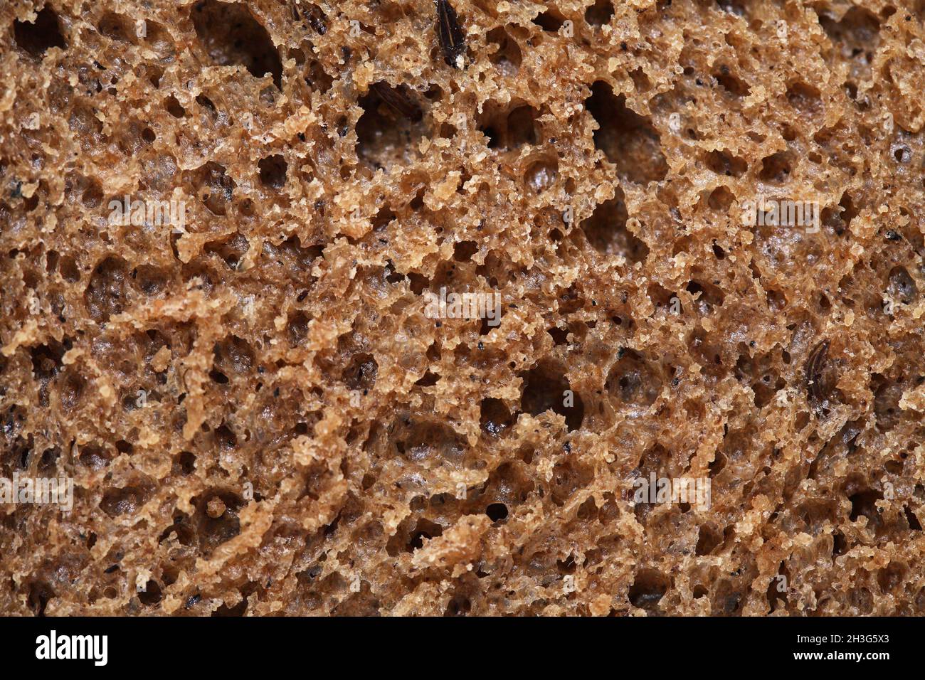 Extreme closeup of slice of rye bread as background Stock Photo - Alamy