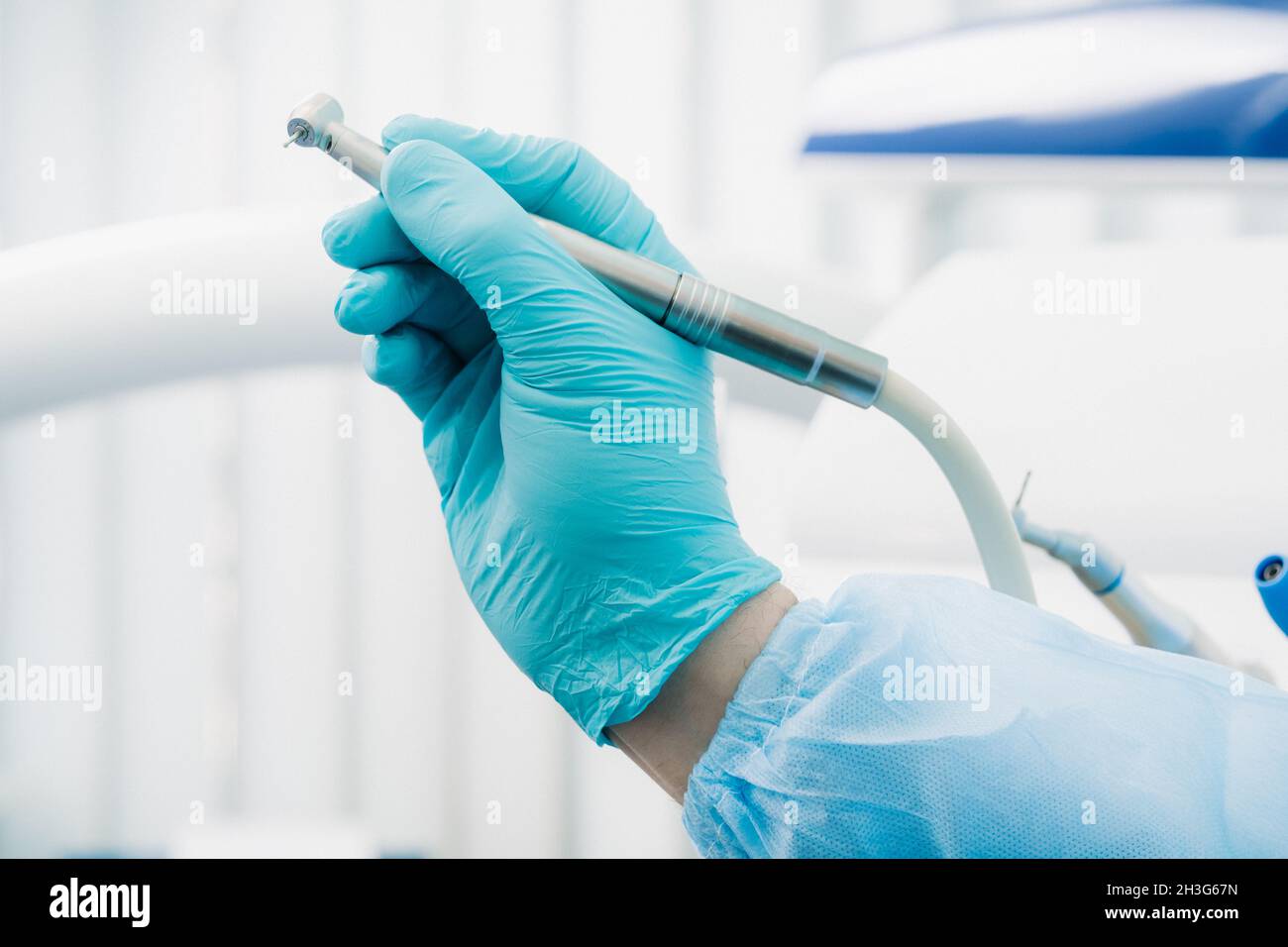 Dentist holds tools in hands hi-res stock photography and images - Alamy