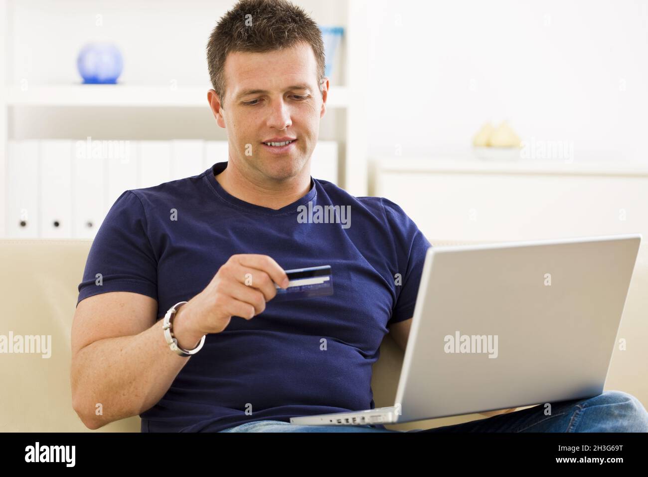Man shopping online Stock Photo - Alamy